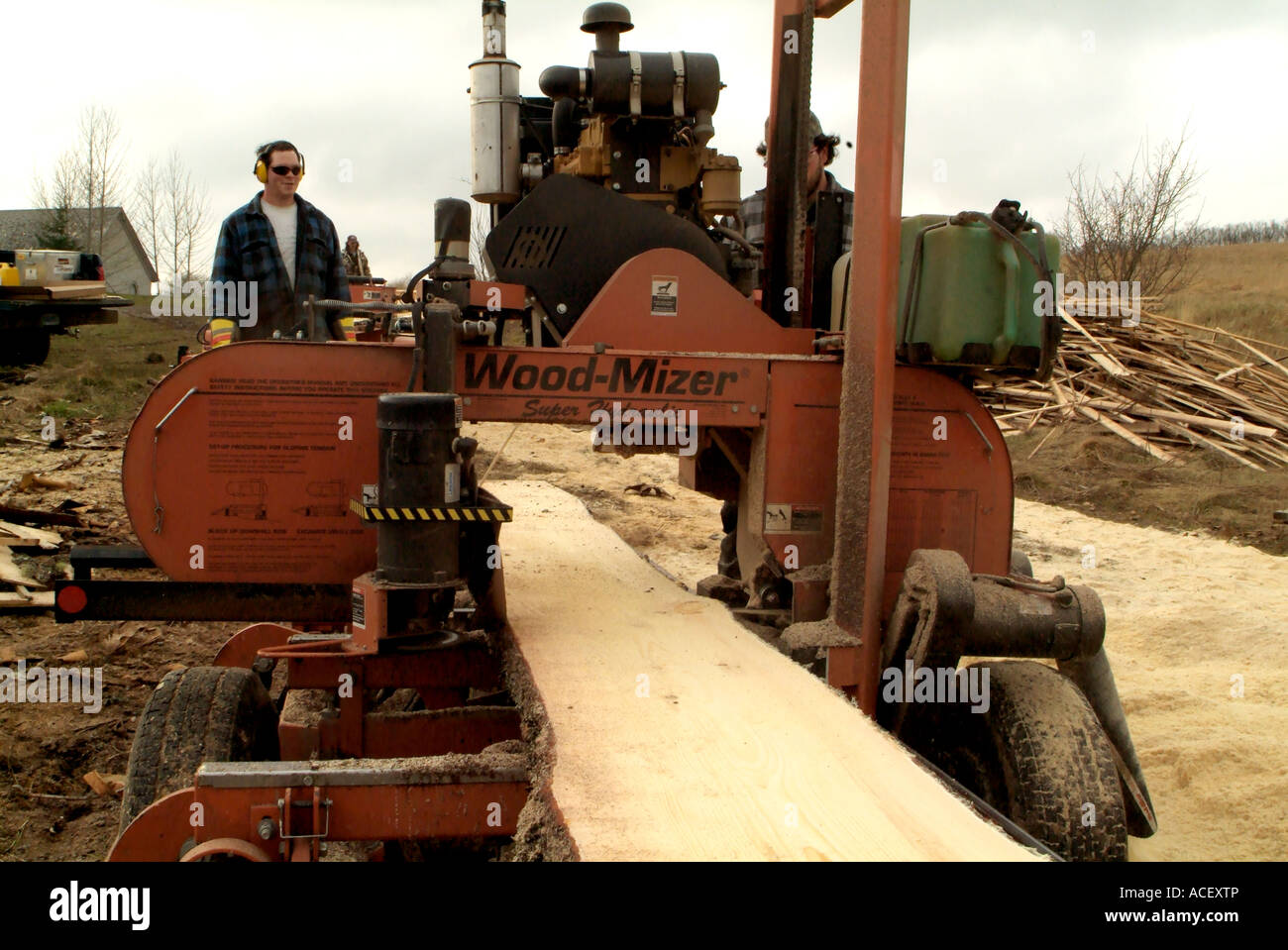 men cutting lumber Stock Photo - Alamy