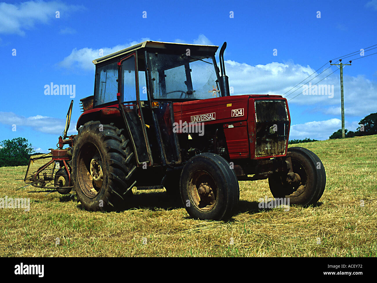 Tractor in stubble Stock Photo - Alamy