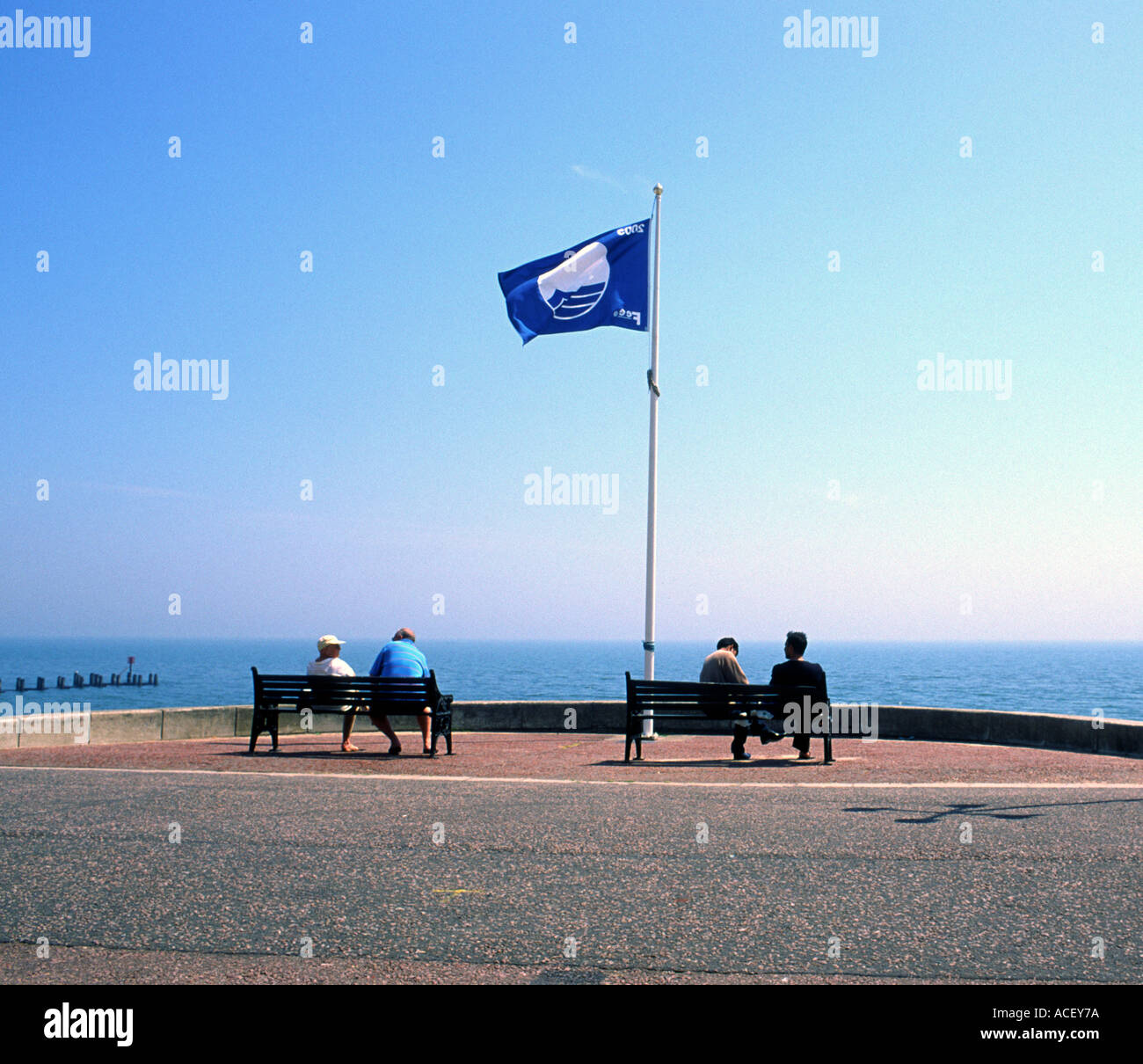 Seafront benches with flag Lowestoft Suffolk Stock Photo - Alamy