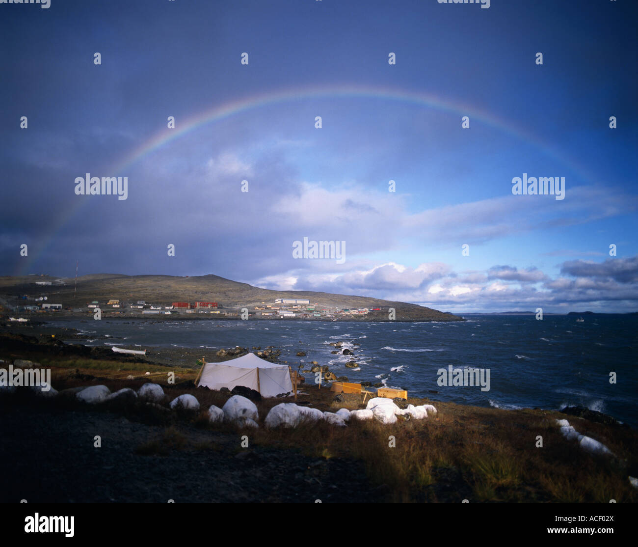 Small village water tent and rainbow Stock Photo - Alamy