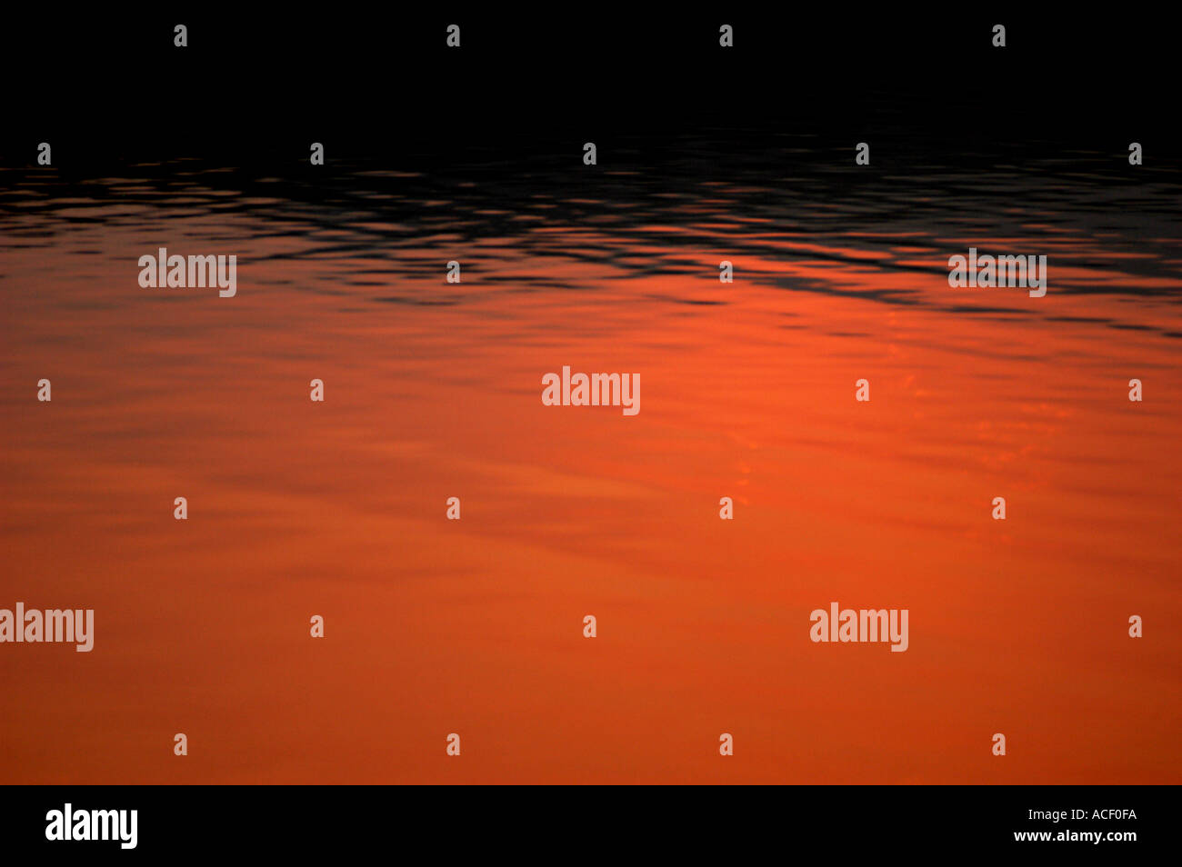 Sunset reflection on lake Stock Photo - Alamy