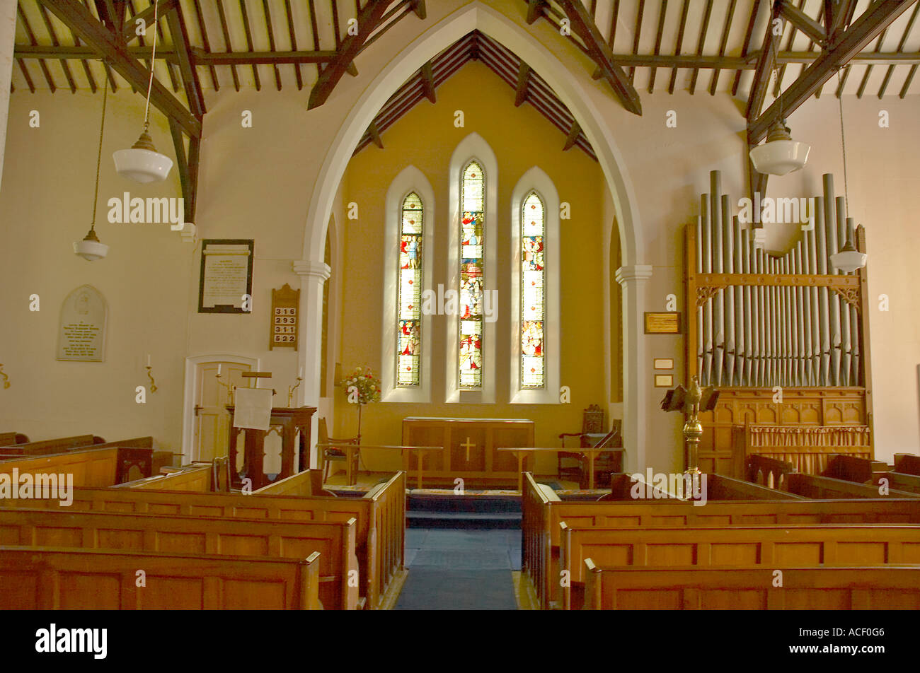 Interior of a christian church showing the alter pulpit stained glass ...