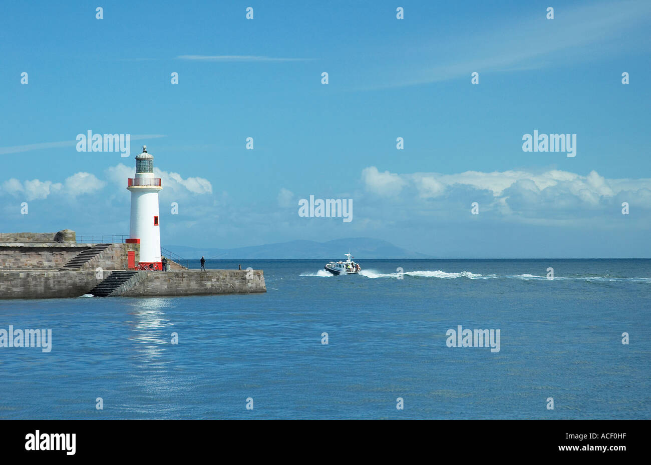 Entrance and Lighthouse to the Port of Whitehaven Stock Photo - Alamy