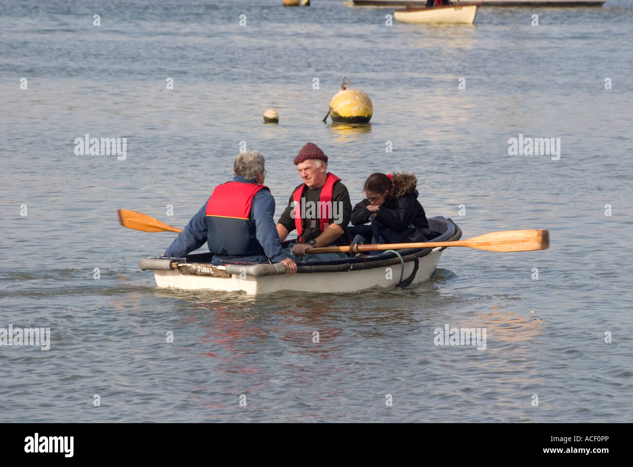 Rowing out to the Yacht in small Tender Stock Photo - Alamy