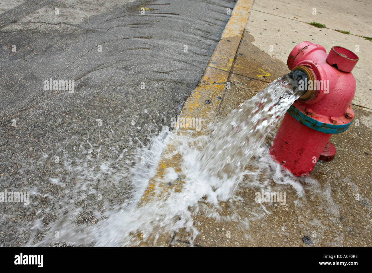 STREET SCENE Chicago Illinois Fire hydrant opened and water pouring out ...