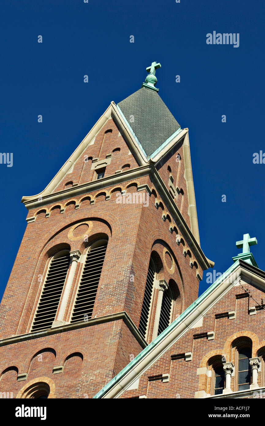 STREET SCENE Chicago Illinois Red brick church steeple spire and cross ...