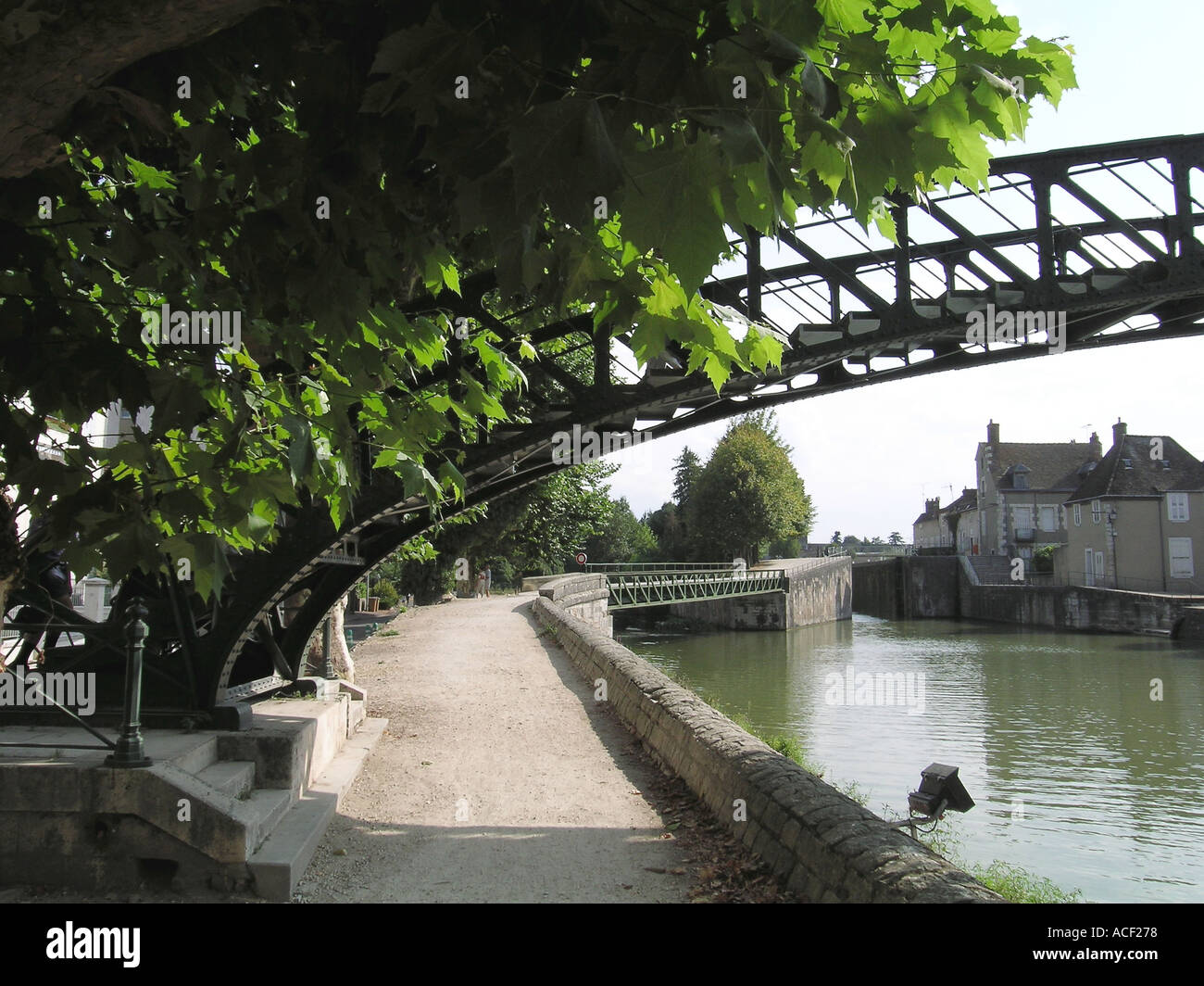Path and iron bridge over canal at Montargis France Stock Photo - Alamy
