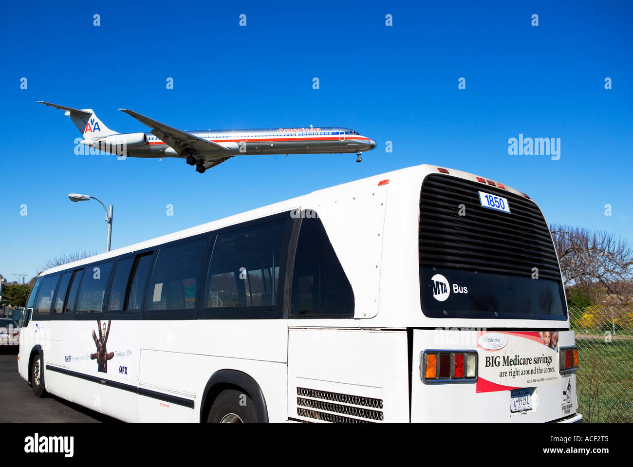 PLAIN FLYING OVER BUS Stock Photo - Alamy