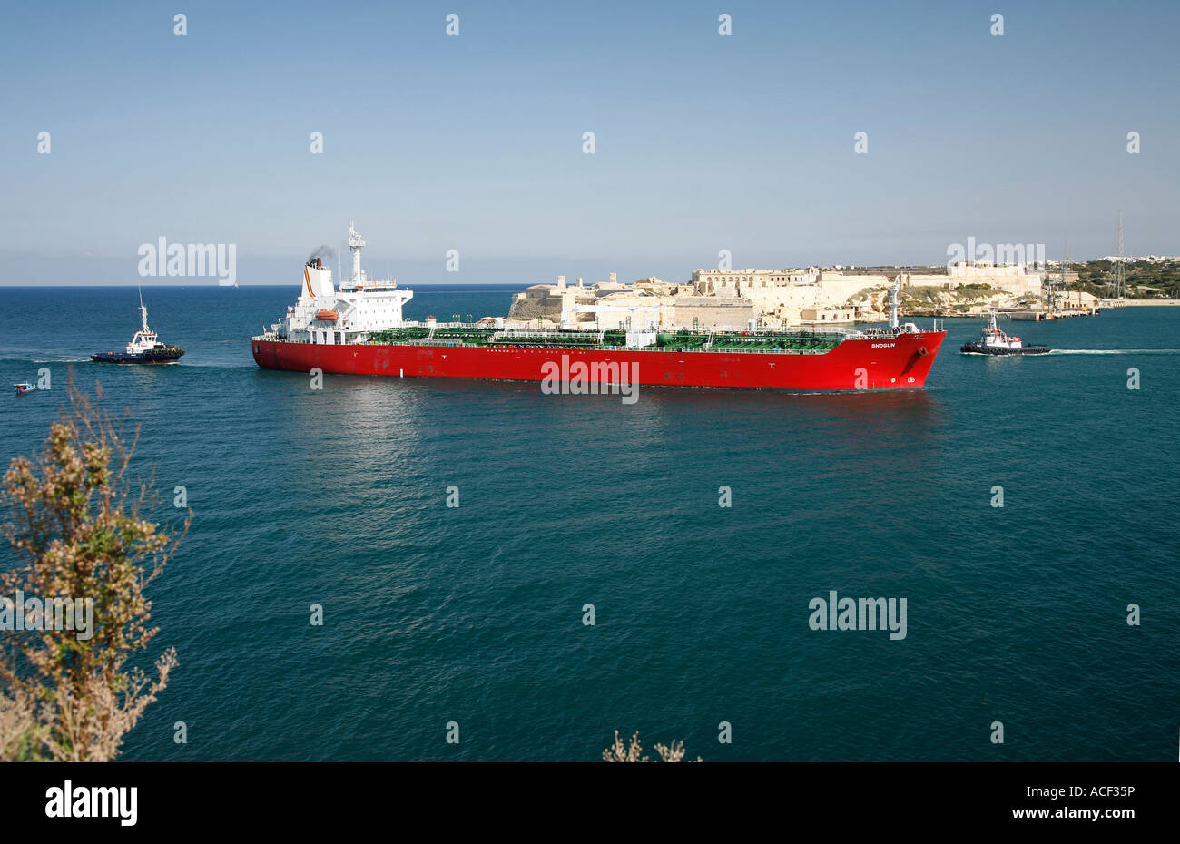 Container Ship entering Grand Harbour, Valletta, Malta, escorted by Tug ...