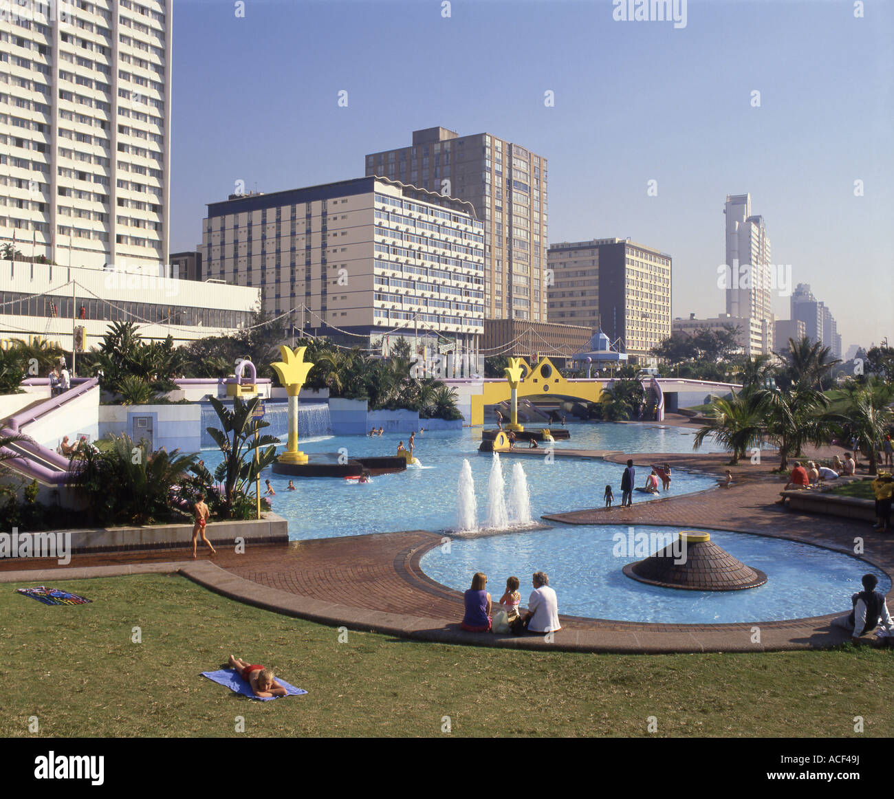 Small swimming pools on Durban South Beach with high rise apartments ...