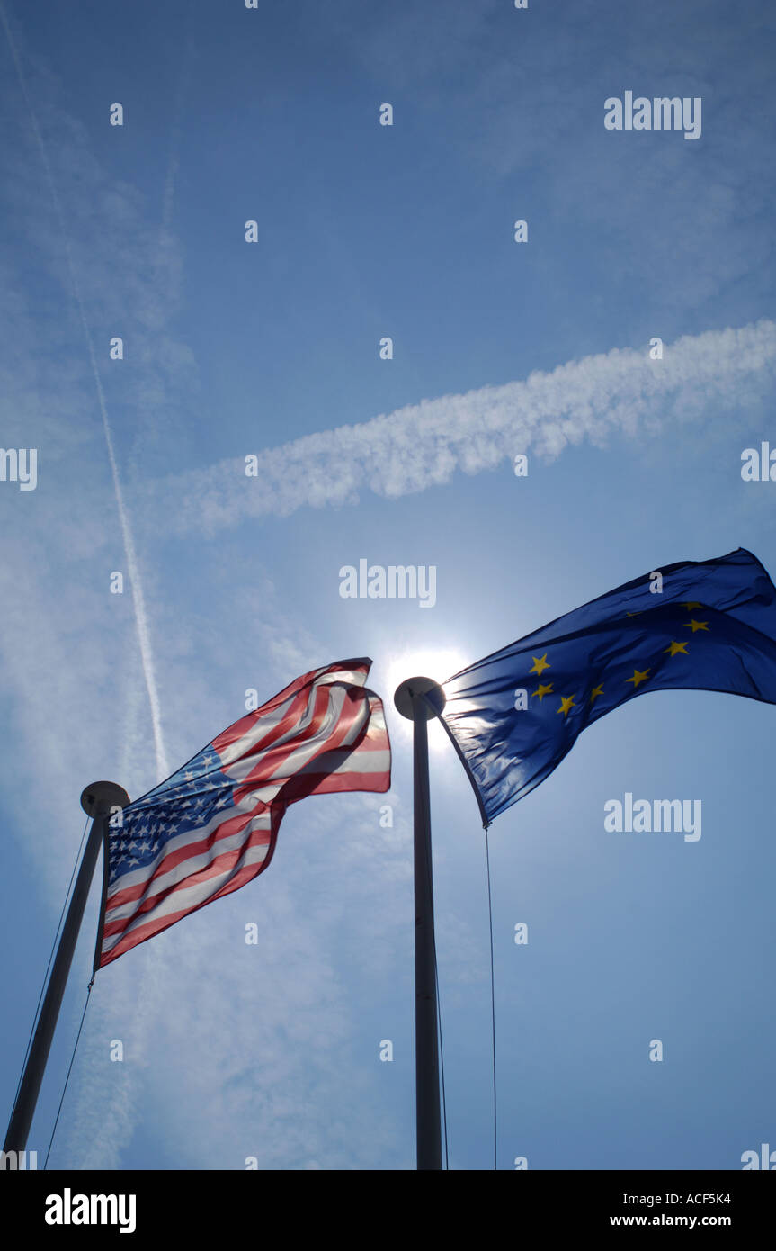 US and EU flags fly alongside each other against a blue sky Stock Photo ...