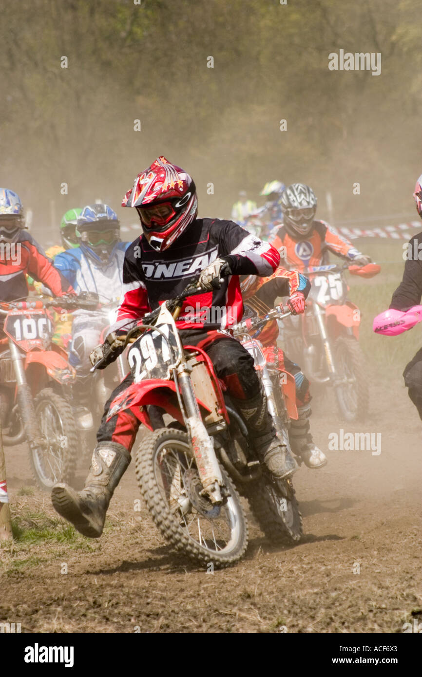 Motocross riders cornering during race Stock Photo - Alamy