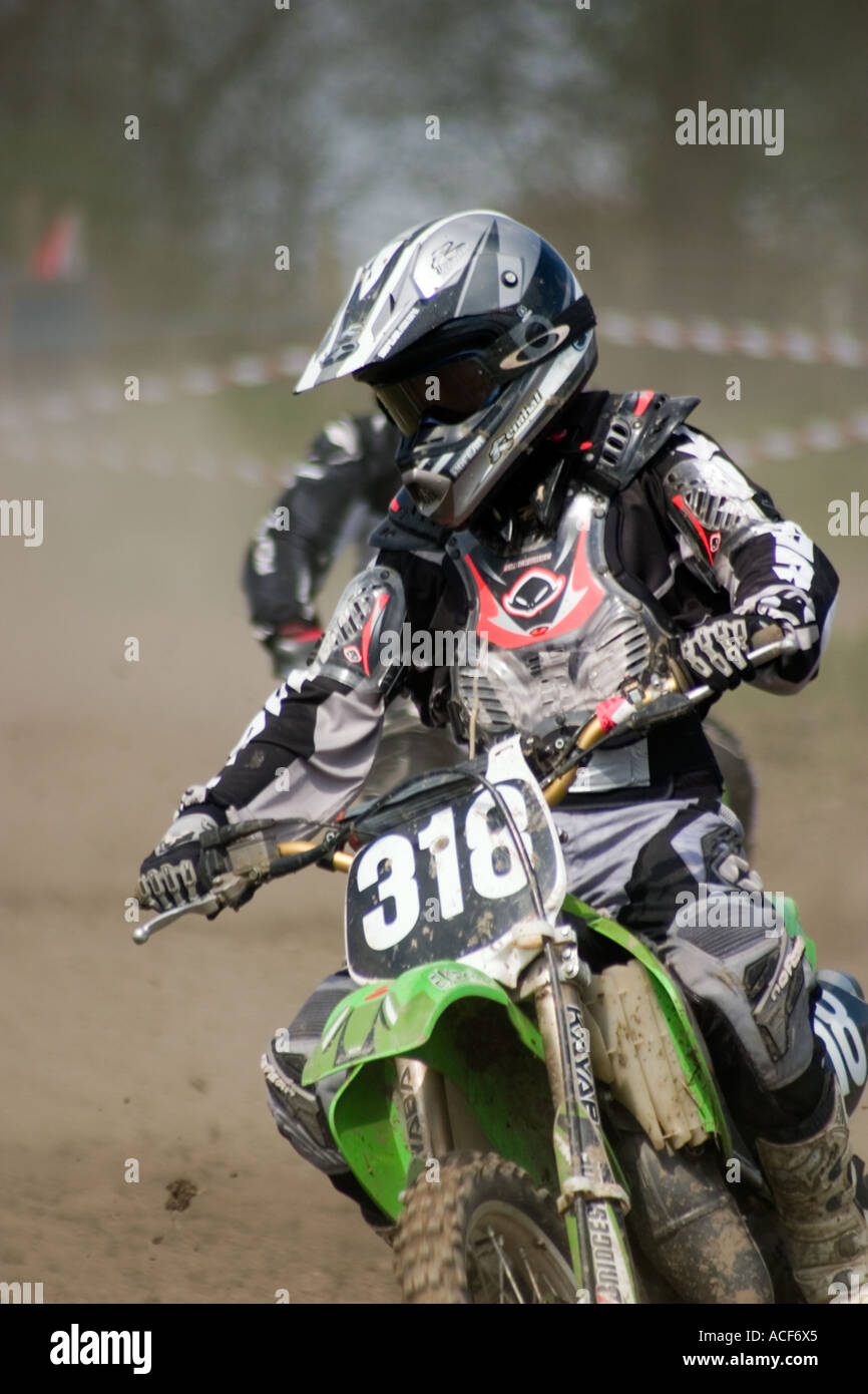 Motocross riders cornering during race Stock Photo - Alamy