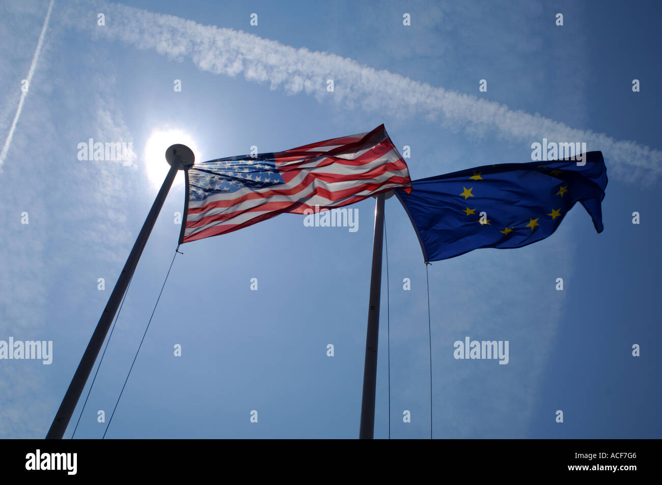 US and EU flags flying side by side against a blue sky Stock Photo - Alamy