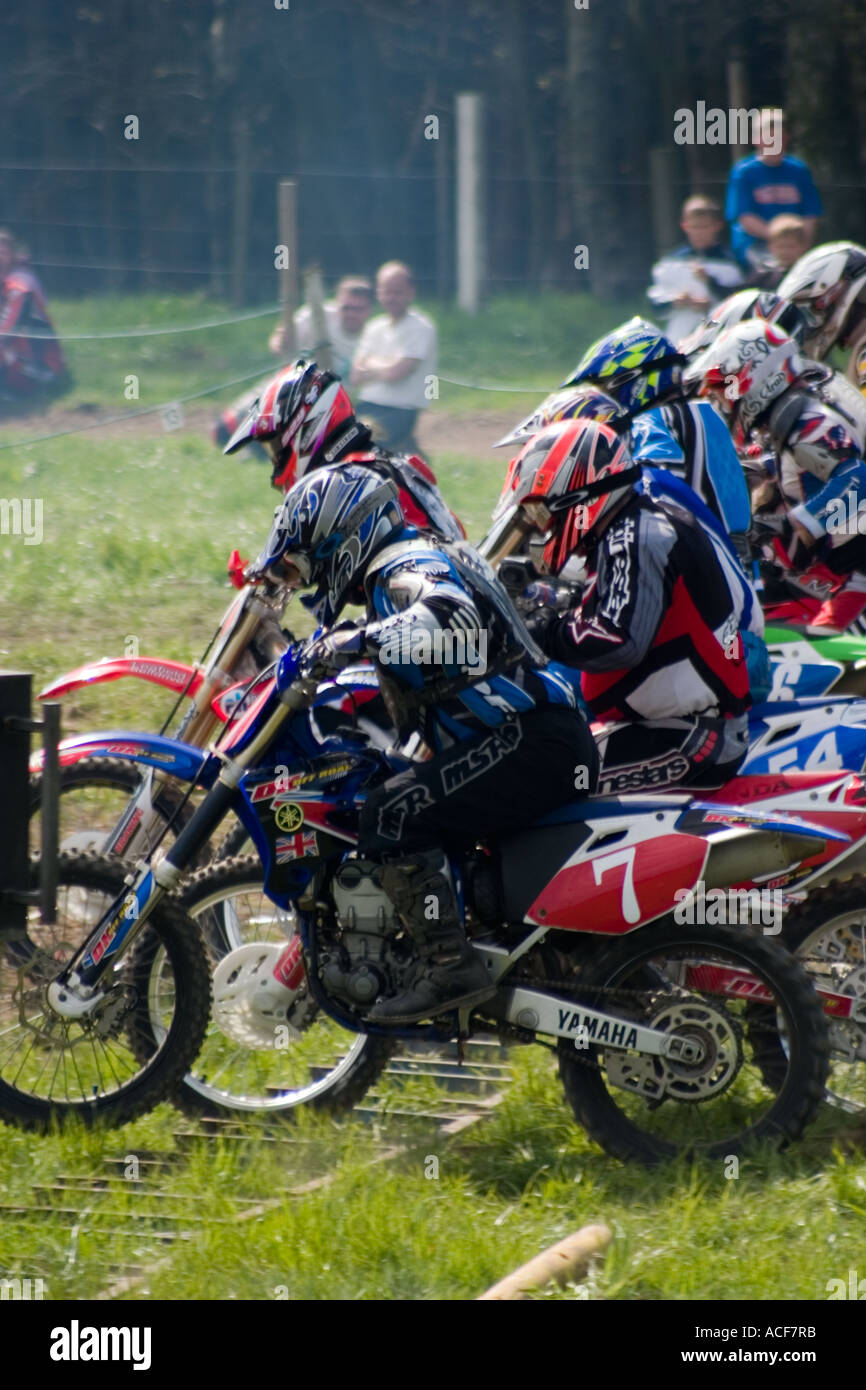 Bikes and riders setting off at start of Motocross race Stock Photo - Alamy