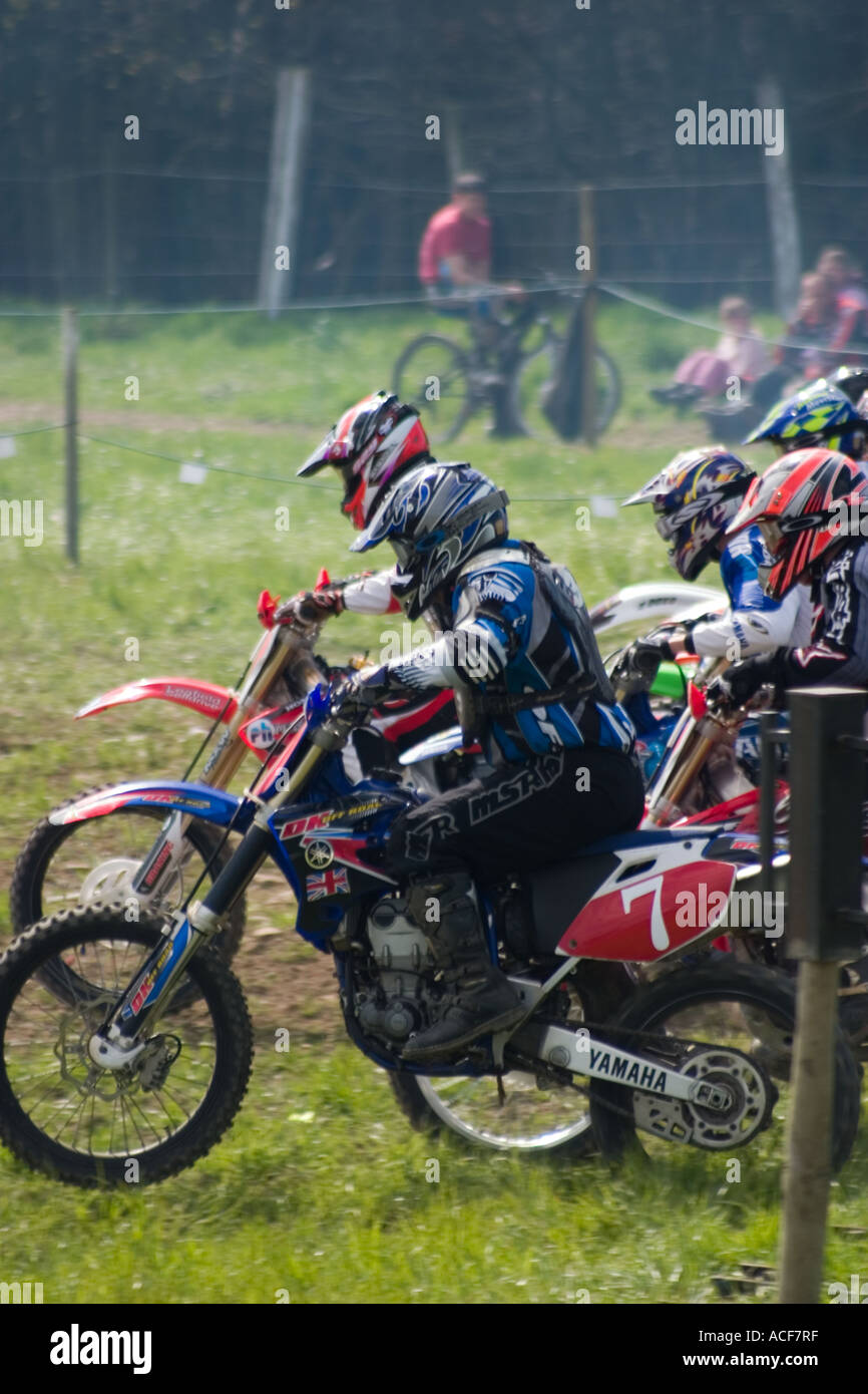 Bikes and riders setting off at start of Motocross race Stock Photo - Alamy