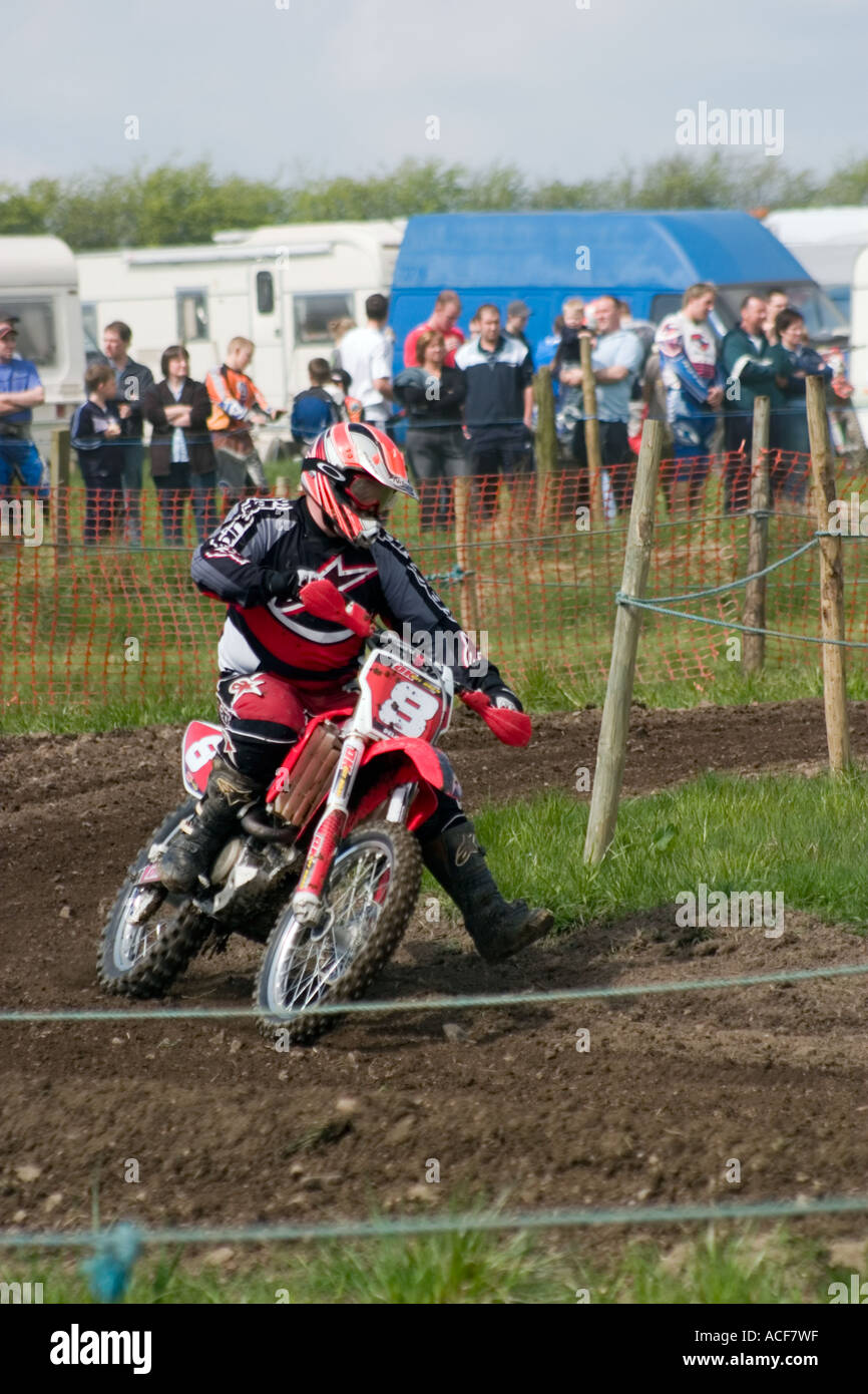 Motocross rider cornering during race Stock Photo - Alamy