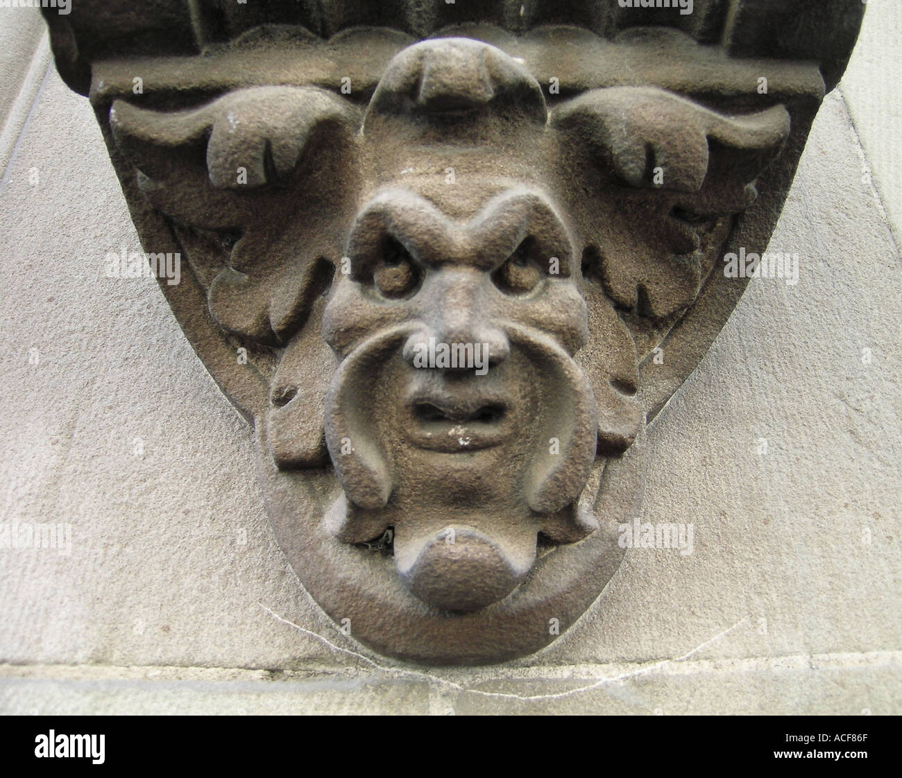 Stone devil at base of pillar on building in Strasbourg France Stock ...