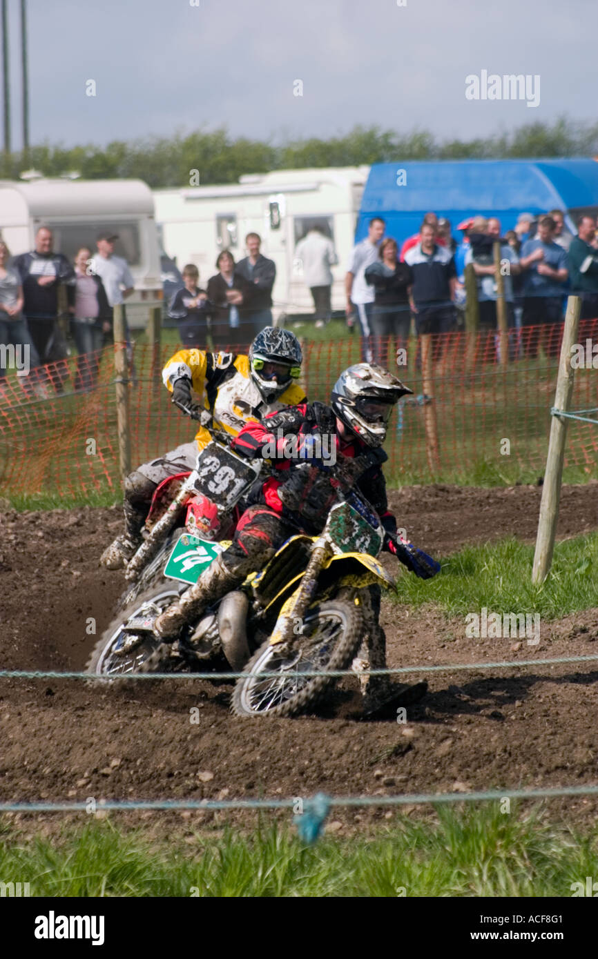 Group of Motocross riders cornering during race Stock Photo - Alamy