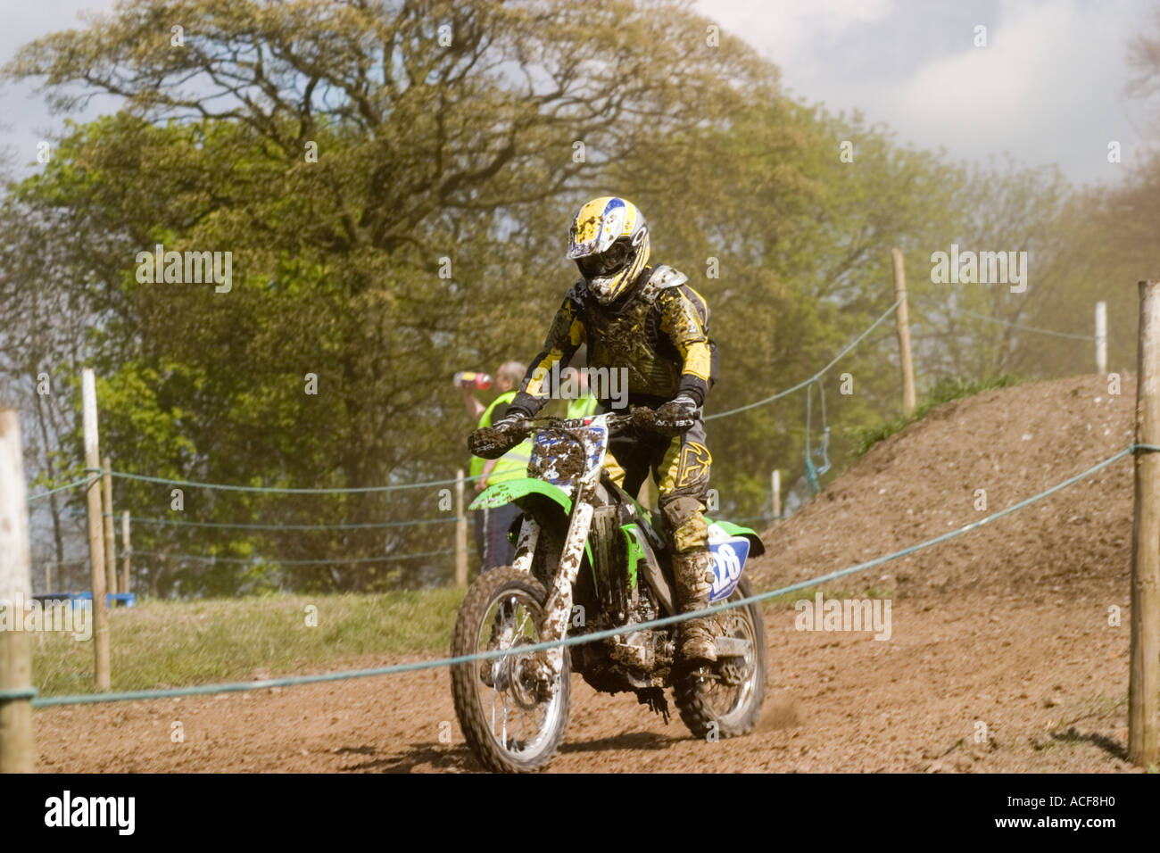 Motocross rider landing after jump Stock Photo - Alamy