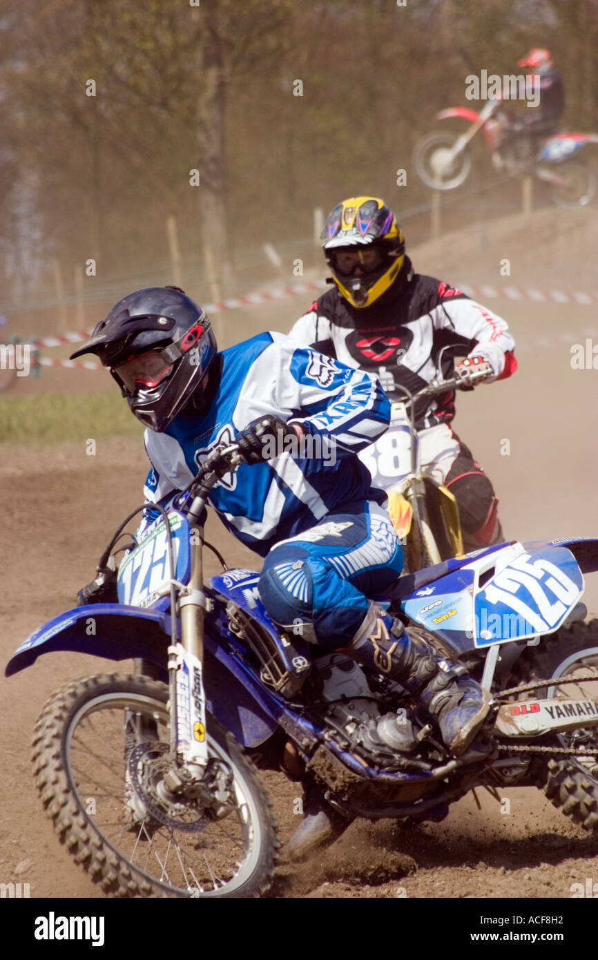 Motocross rider cornering during race Stock Photo - Alamy