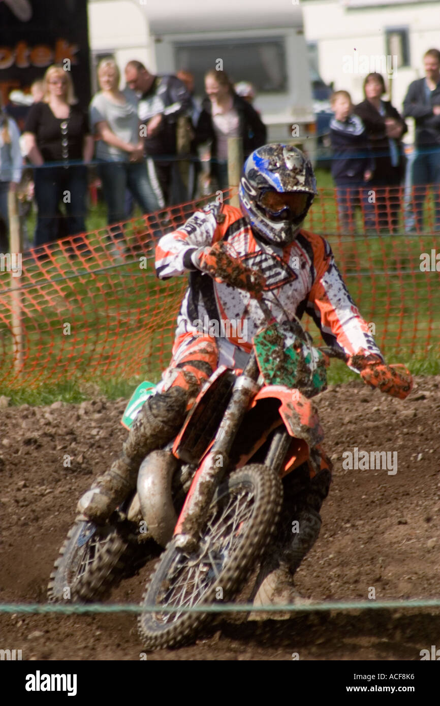 Motocross rider cornering during race Stock Photo - Alamy