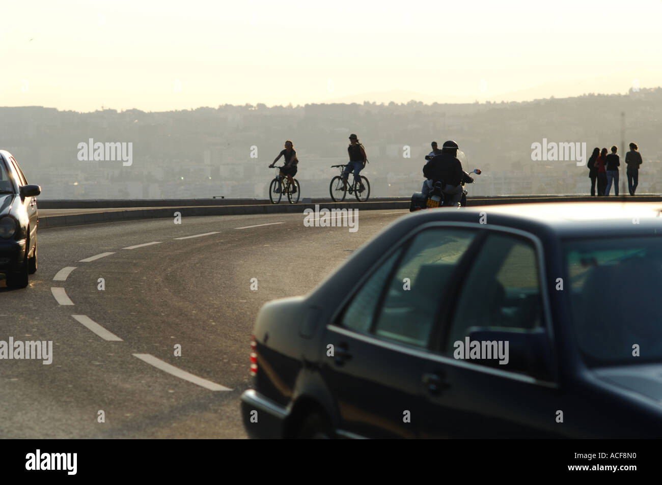 Cyclists and traffic on the seafront at Nice, South of France Stock ...