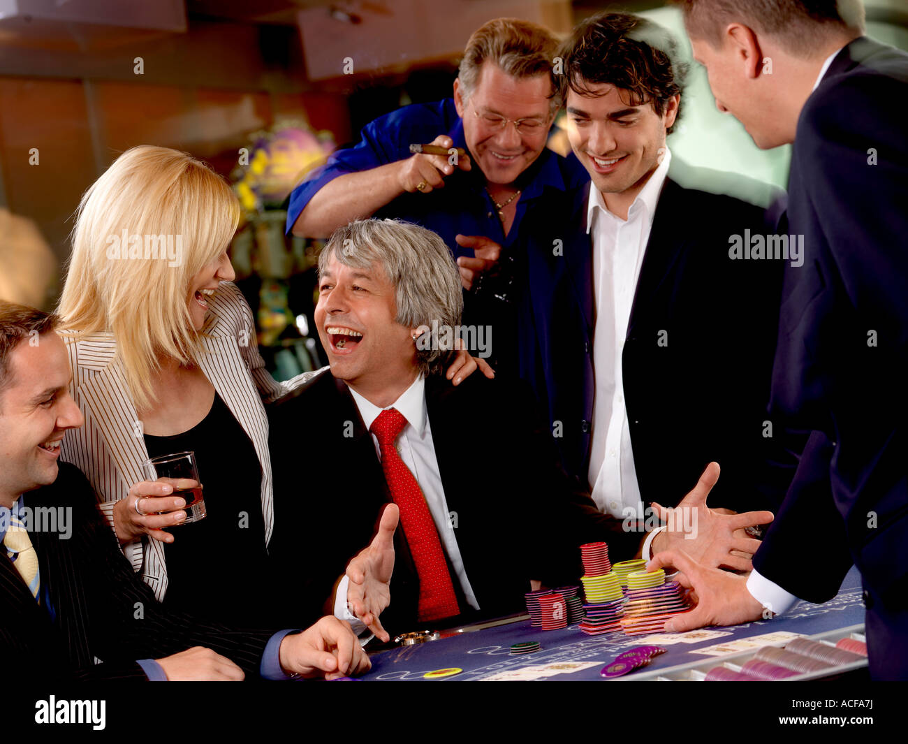 people playing a card game in a casino Stock Photo - Alamy