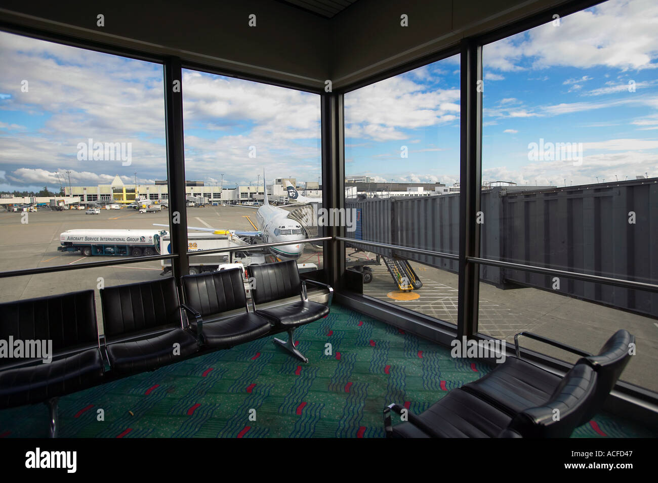 View of Waiting Area and Parked Plane at Airport Stock Photo - Alamy
