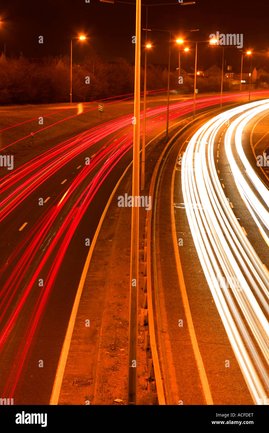 Speeding light trails from traffic on a busy road at night, generic ...