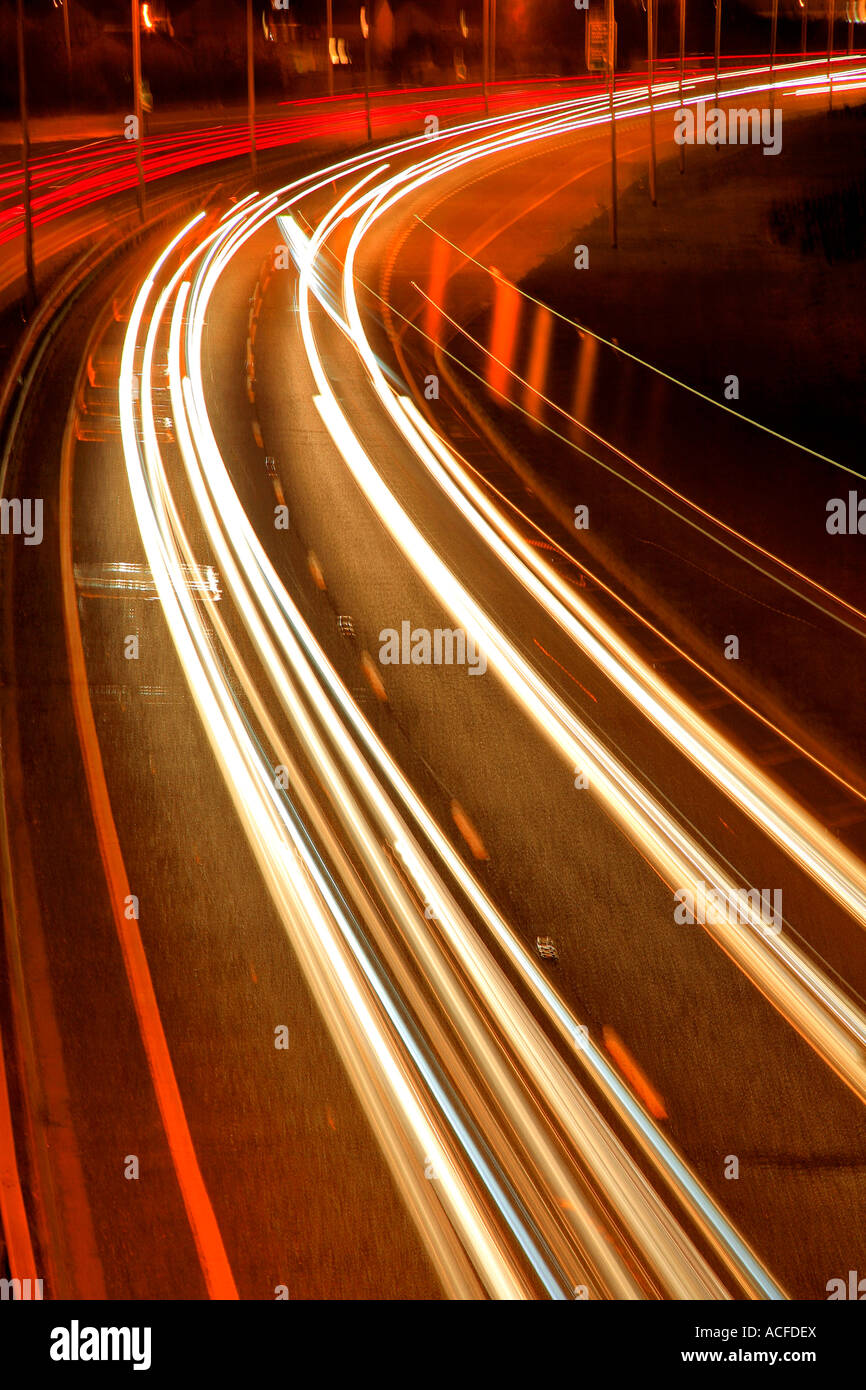 Speeding light trails from traffic on a busy road at night, generic ...