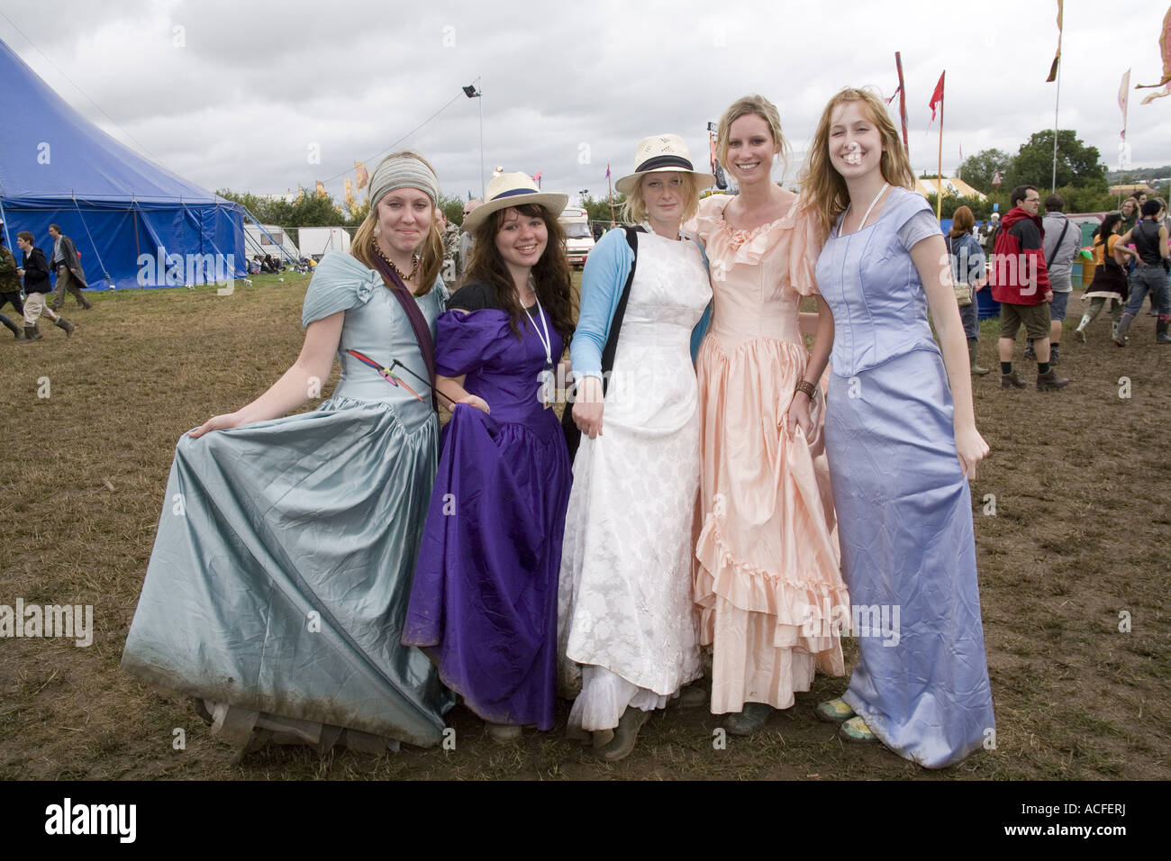 Fancy dress women in wedding dresses at the Glastonbury music festival ...