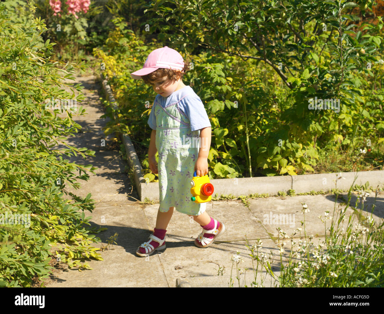 Three Year Old Child in Garden surrey england Stock Photo - Alamy