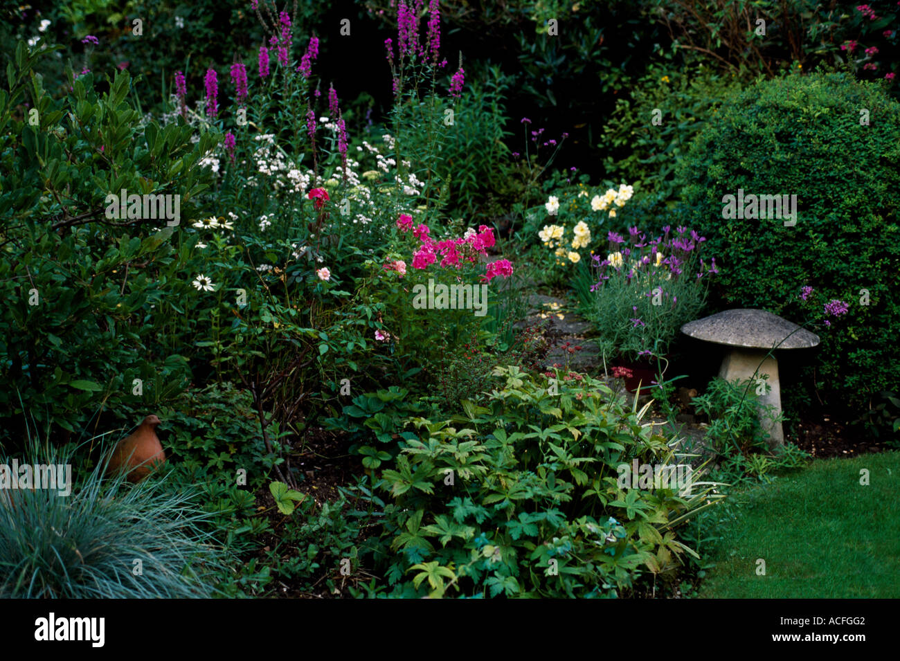 Stone Toadstool in garden Stock Photo - Alamy