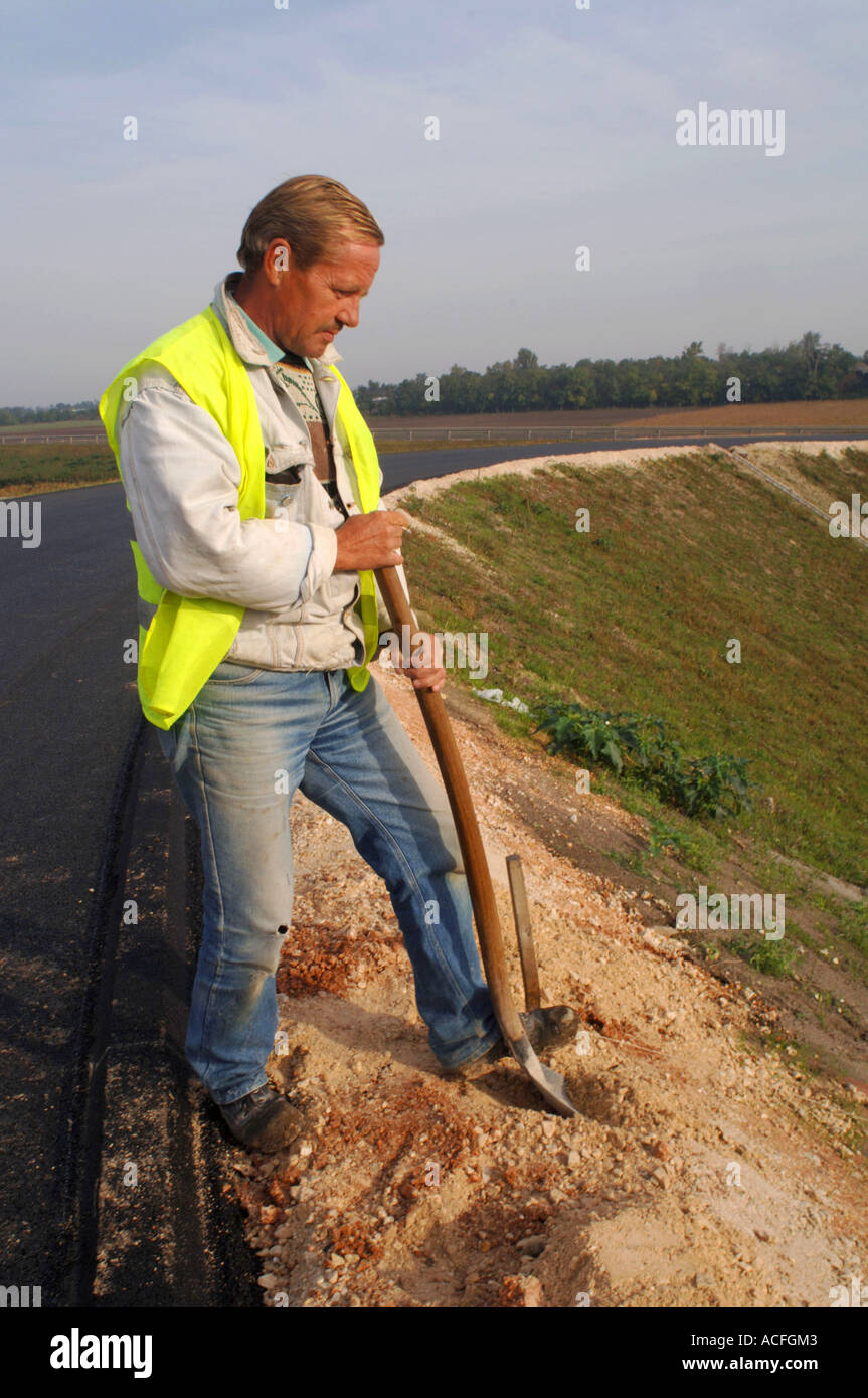 Laying road - workers constructing the M5 toll motorway in Hungary ...