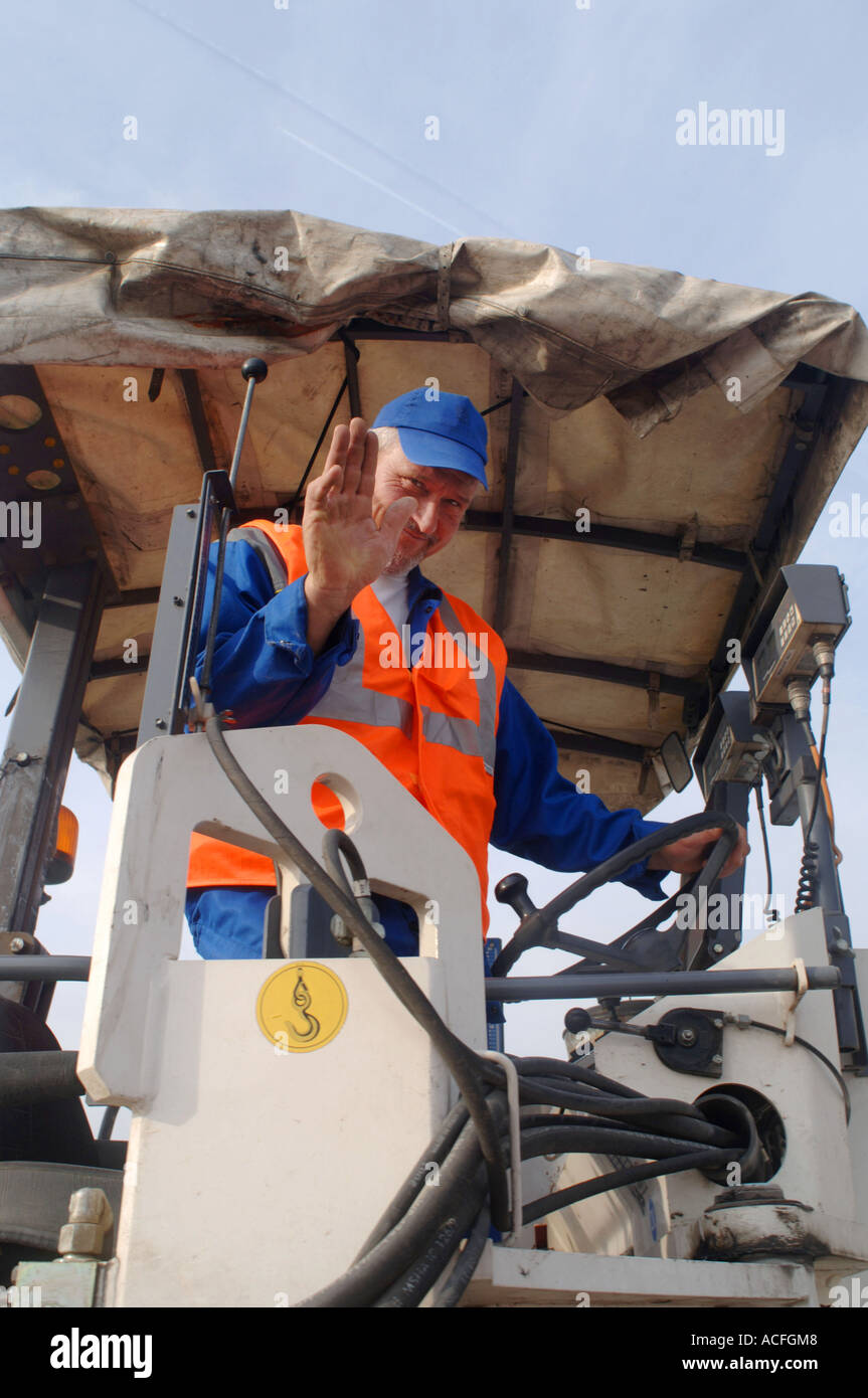Laying road - workers constructing the M5 toll motorway in Hungary ...