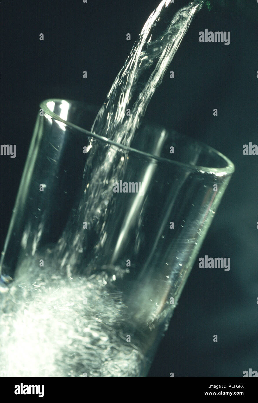 Water pouring into glass Stock Photo - Alamy