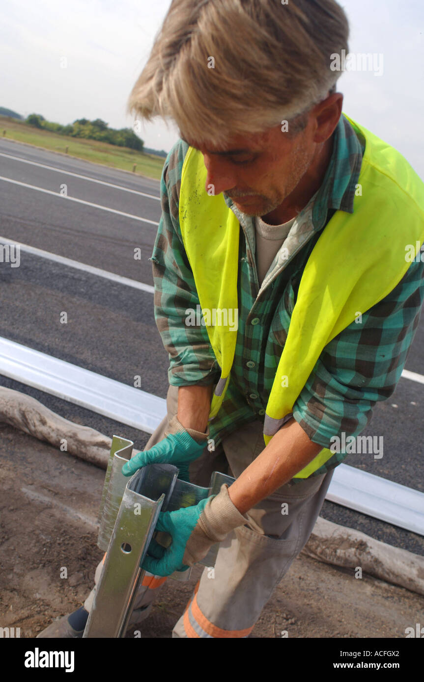 Laying road - workers constructing the M5 toll motorway in Hungary ...