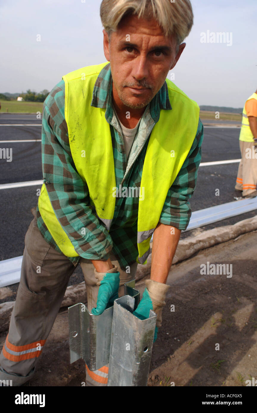 Laying road - workers constructing the M5 toll motorway in Hungary ...