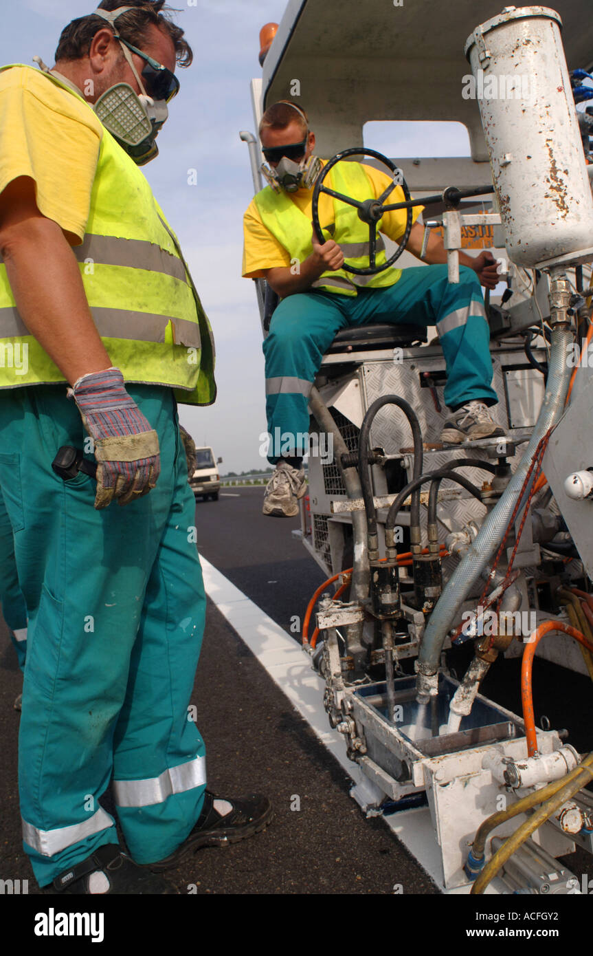 Laying road - workers constructing the M5 toll motorway in Hungary ...