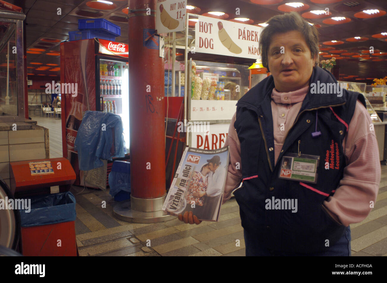 Woman distributing newspapers inside Prague's Main Train Station Stock ...