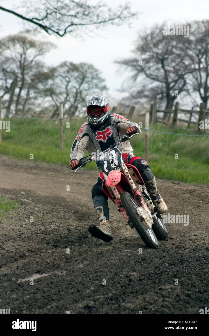 Motocross rider cornering during race Stock Photo - Alamy
