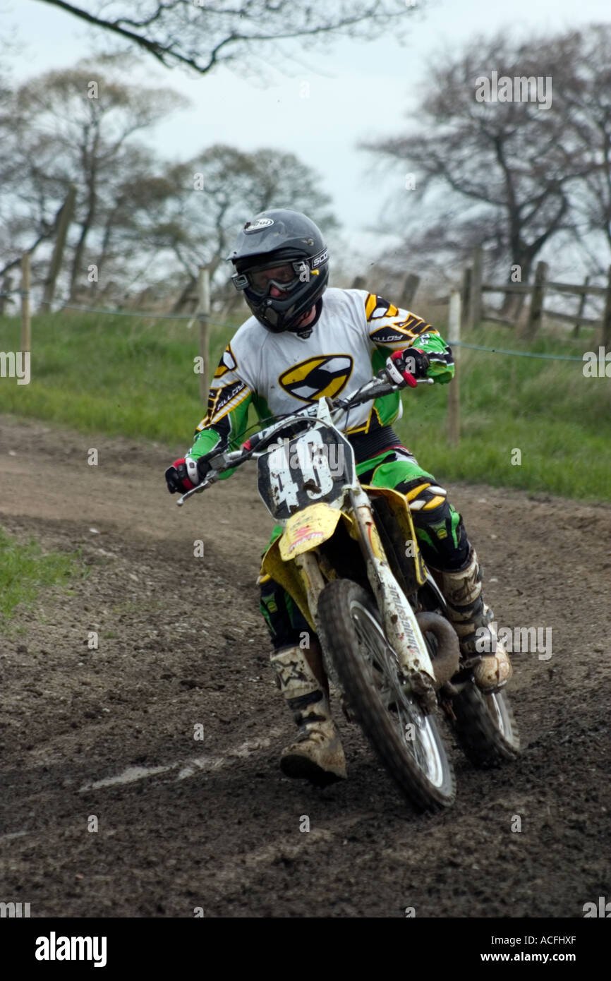 Motocross rider cornering during race Stock Photo - Alamy