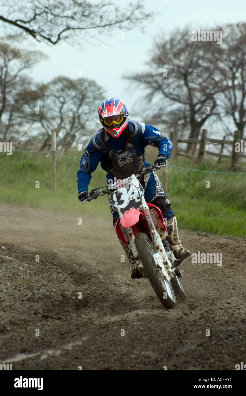 Motocross rider cornering during race Stock Photo - Alamy