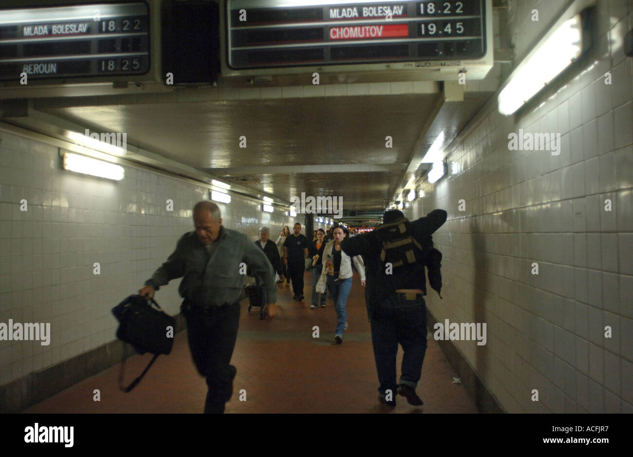 Passengers hurrying to catch a train at Prague's main strain station ...