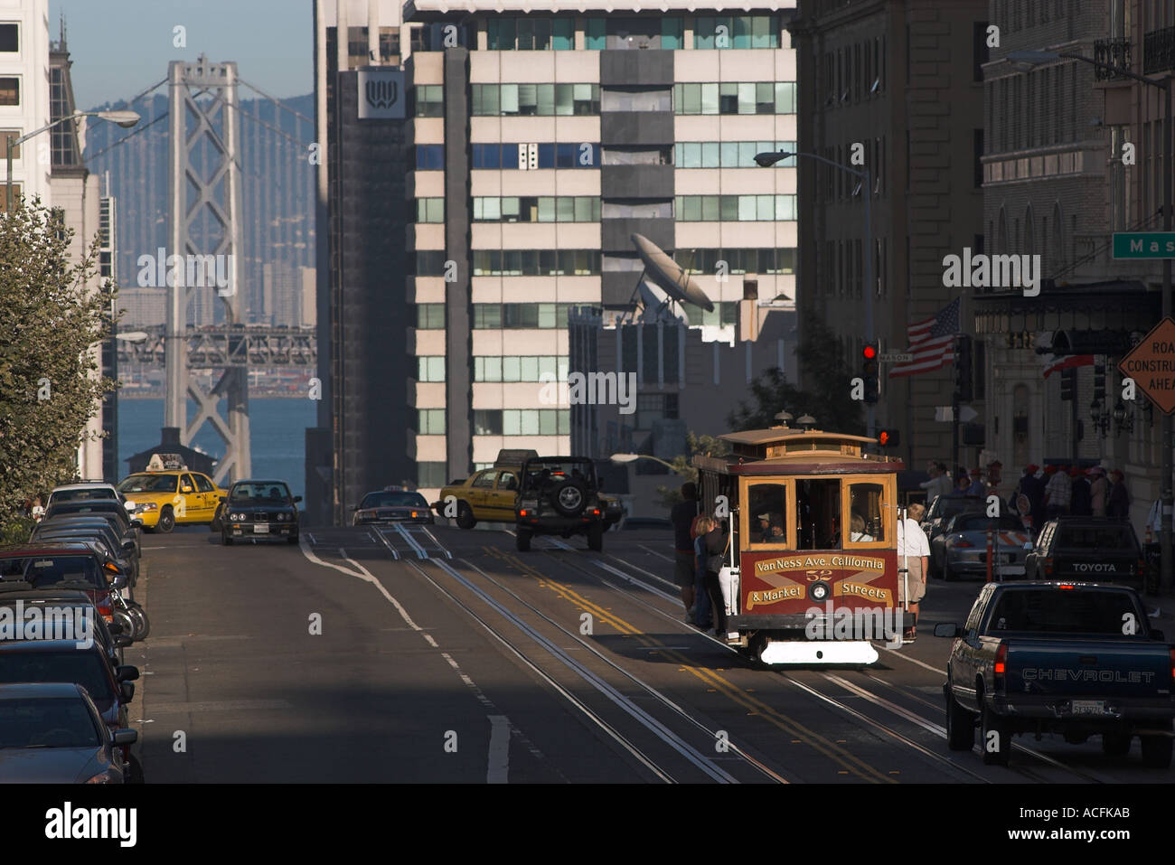 Street scene with cable car and Bay Bridge San Francisco California ...