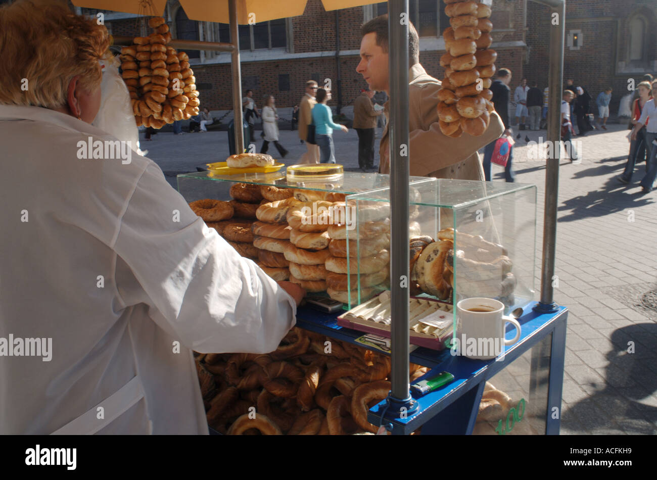 Street trader selling obwarzanki in Krakow, Poland Stock Photo - Alamy