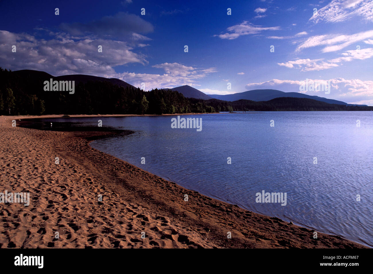 Loch Morlich beach Scottish Highlands set against the Cairngorms Stock ...