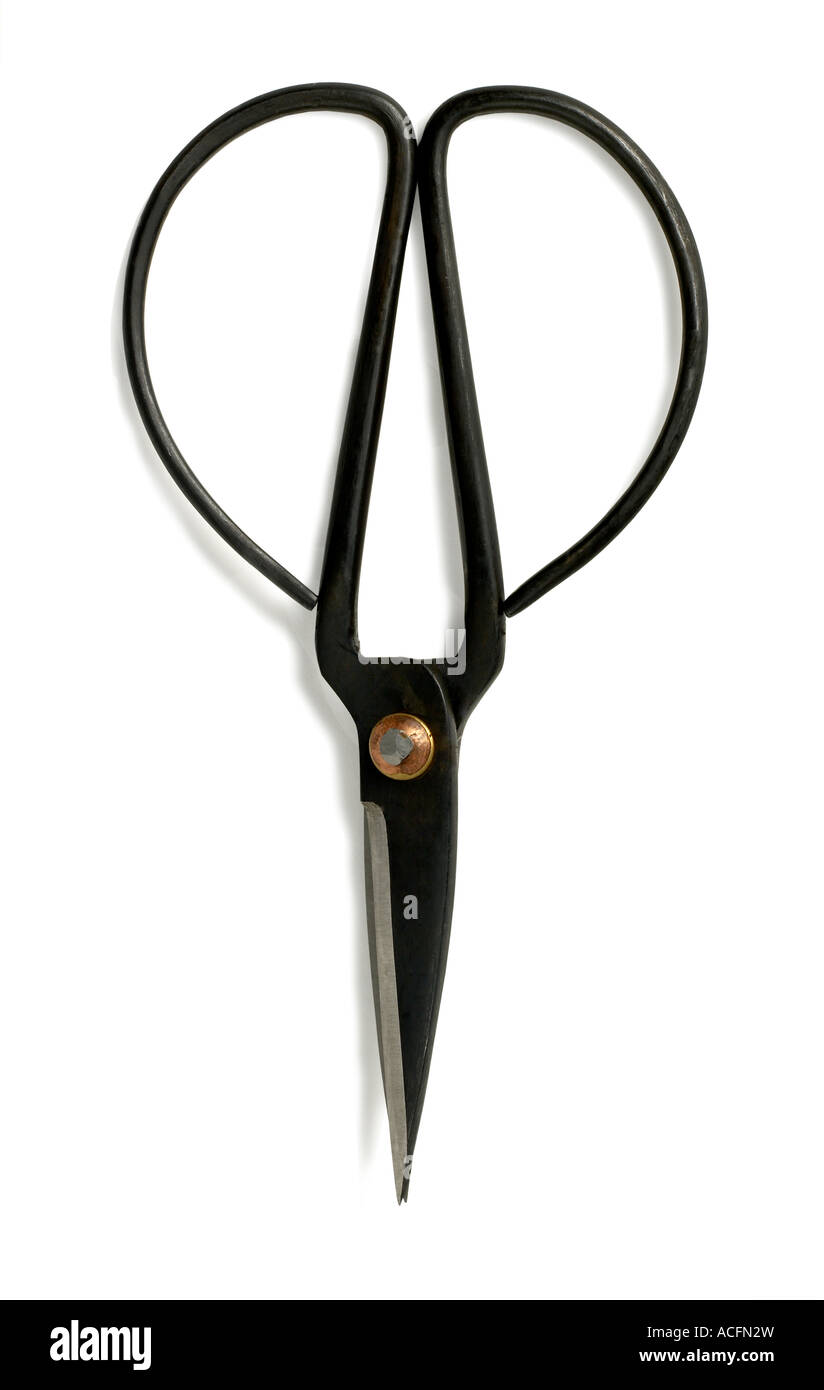 Scissors cutting cloth Cut Out Stock Images & Pictures - Alamy