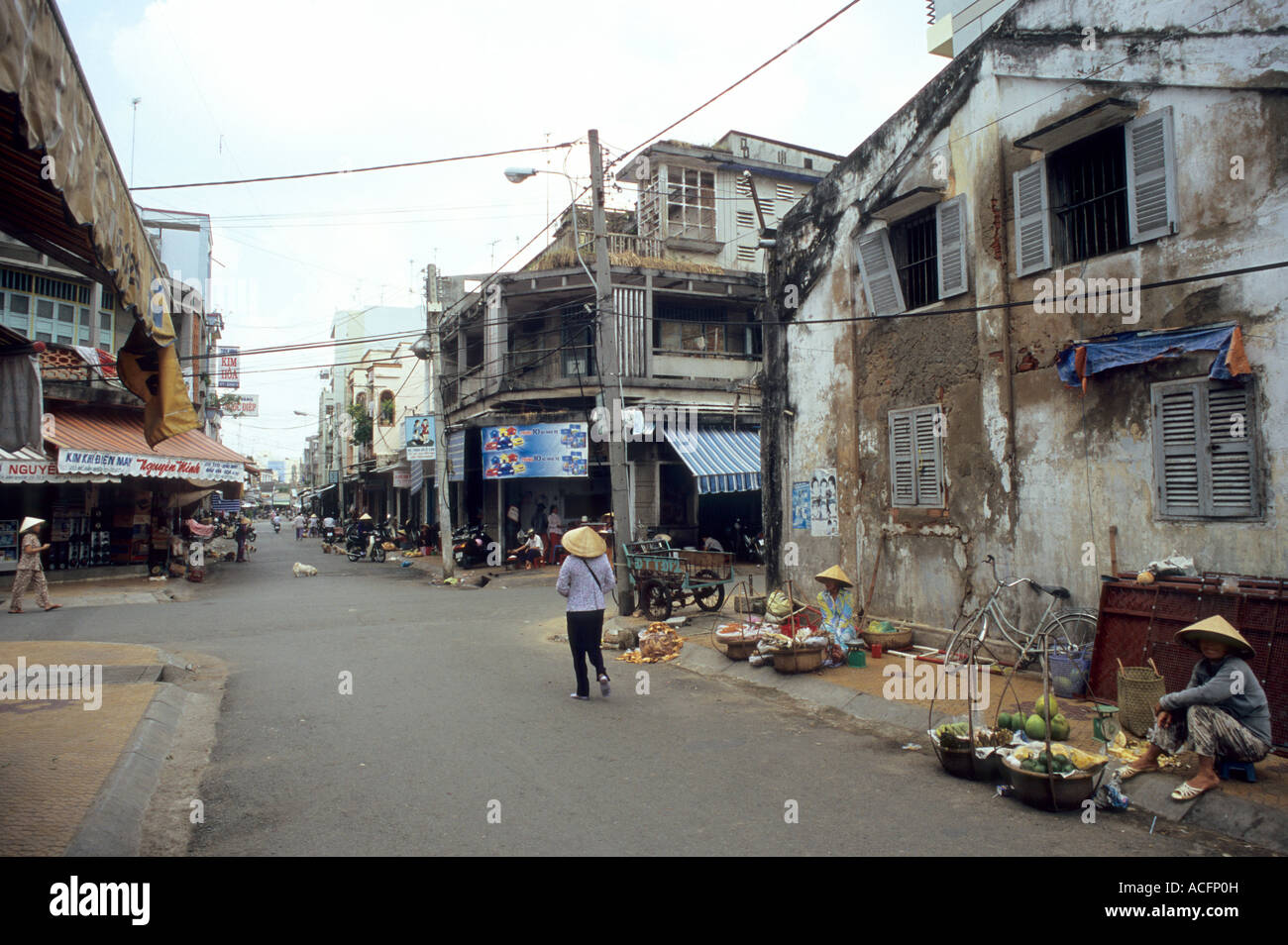 Small shops and street vendors in the town centre, Ben Tre, SW Viet Nam ...